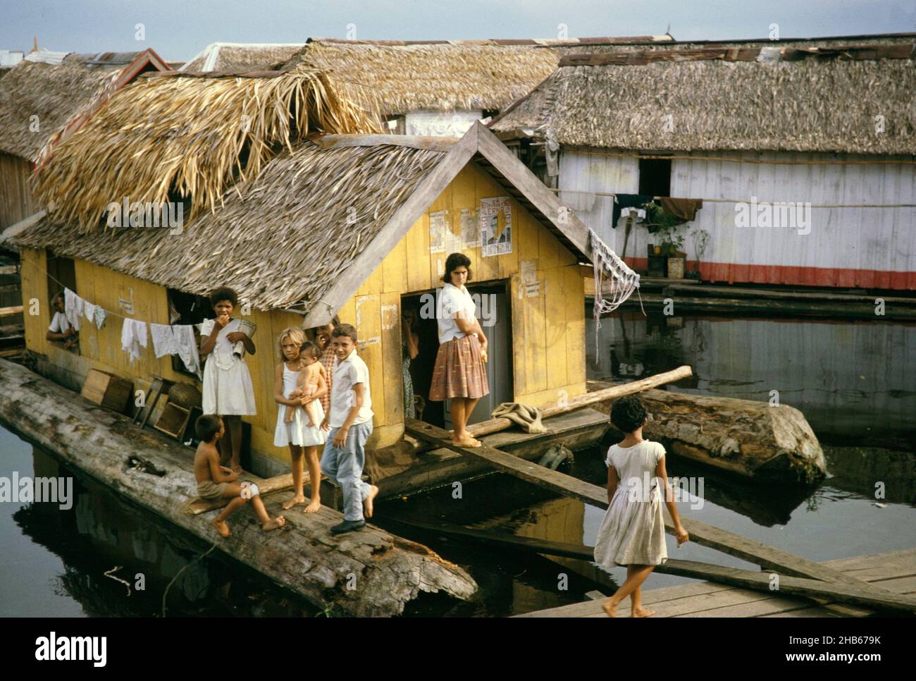 Woman and children in area of Informal housing wooden shacks built on ...