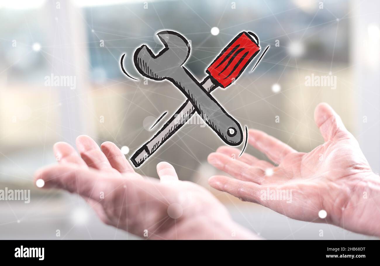 Maintenance service concept above the hands of a man Stock Photo - Alamy