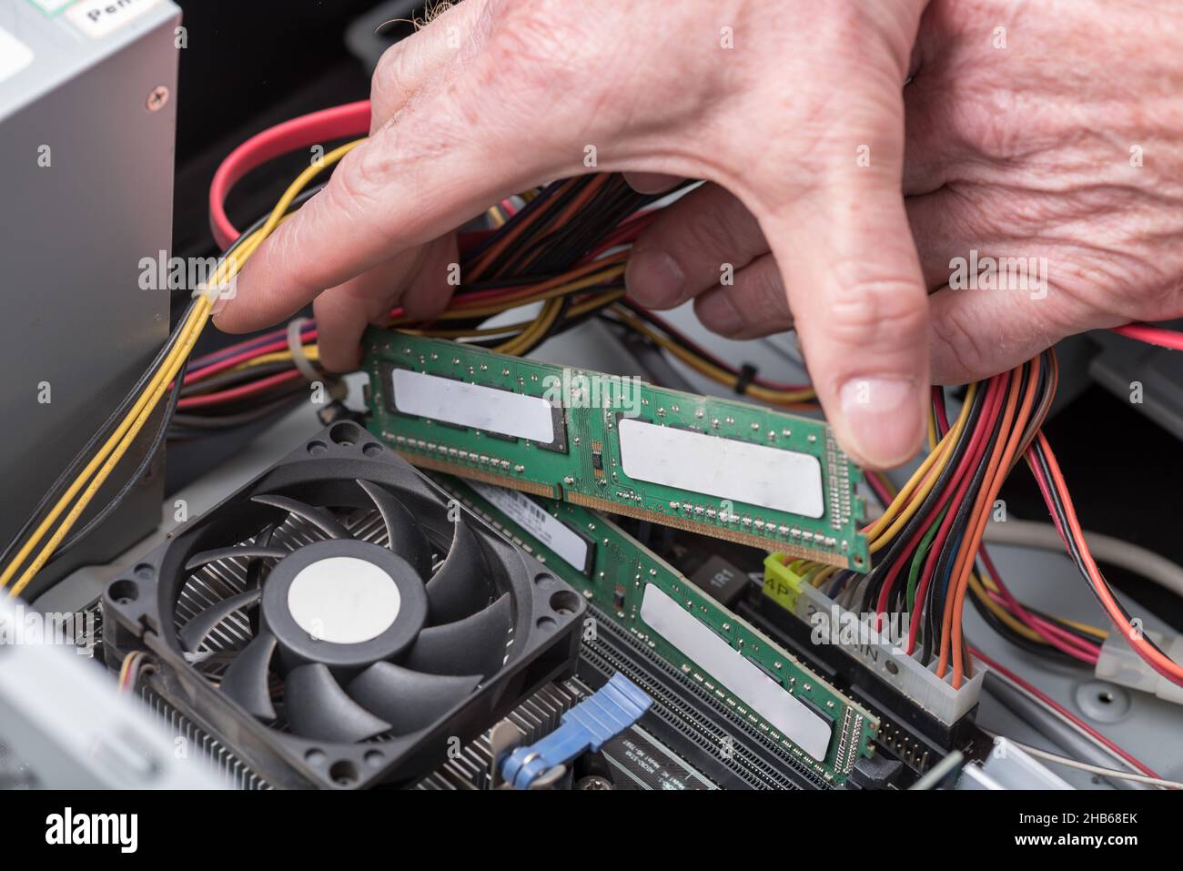 Hands installing ram memory Stock Photo - Alamy