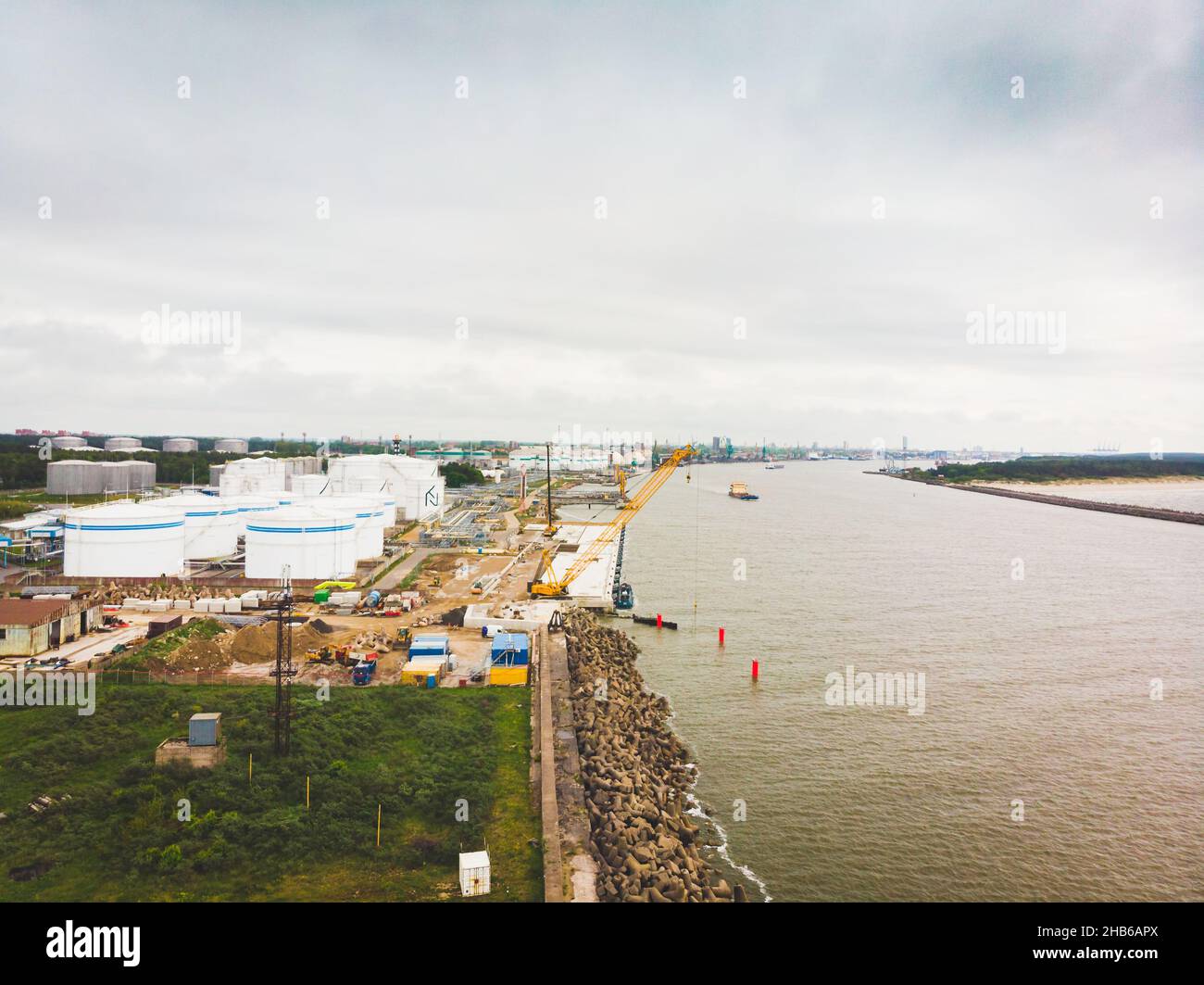 Aerial panoramic view Klaipeda port with leaving cargo ship in ...