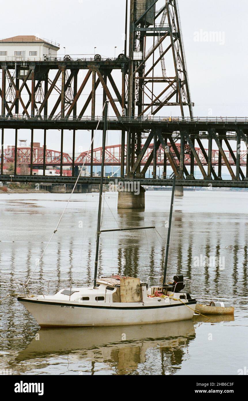 Vertical shot of a boat under the Steel Bridge in Portland, USA Stock ...