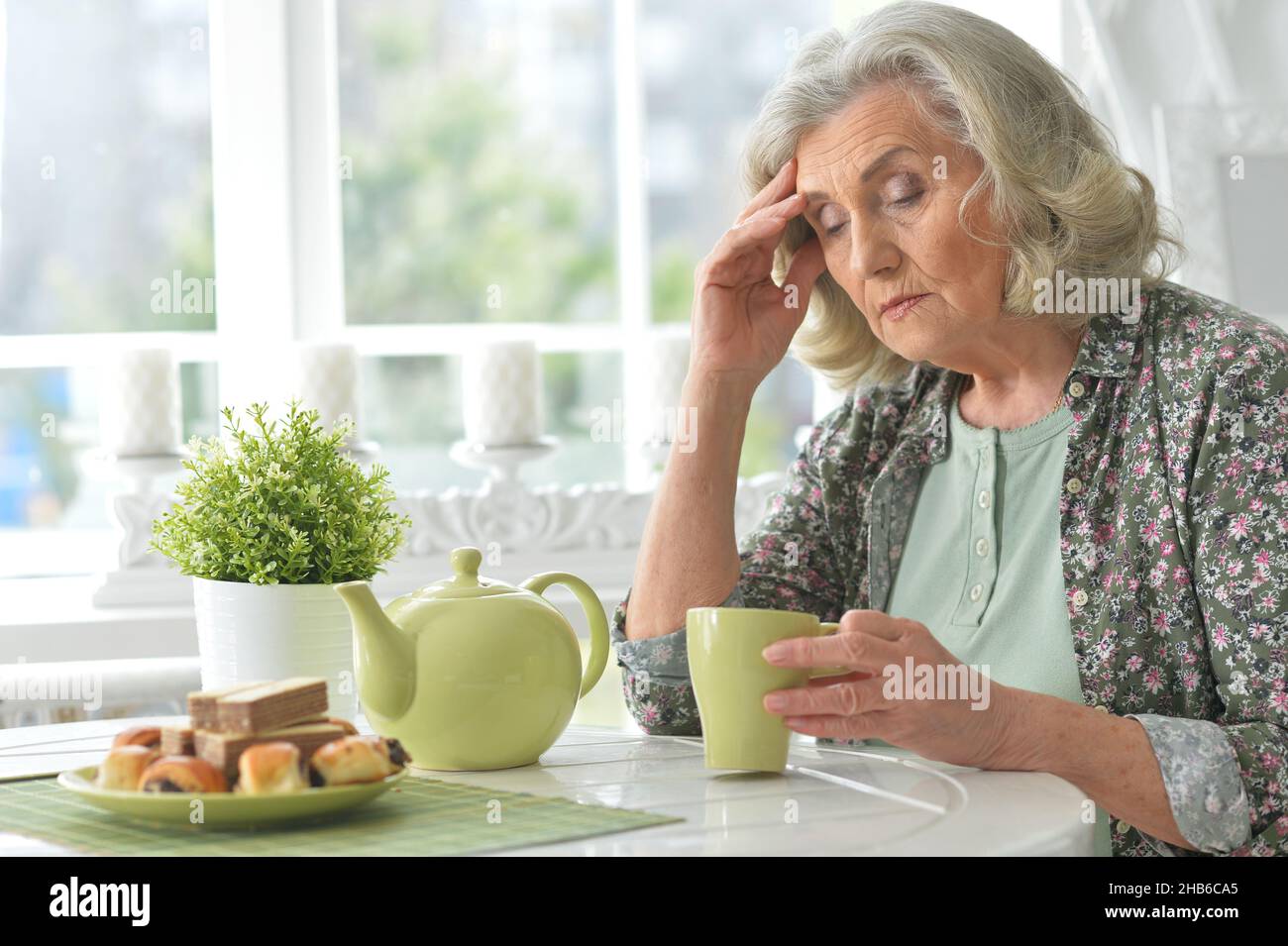 Sad adult woman drinking tea hi-res stock photography and images - Alamy