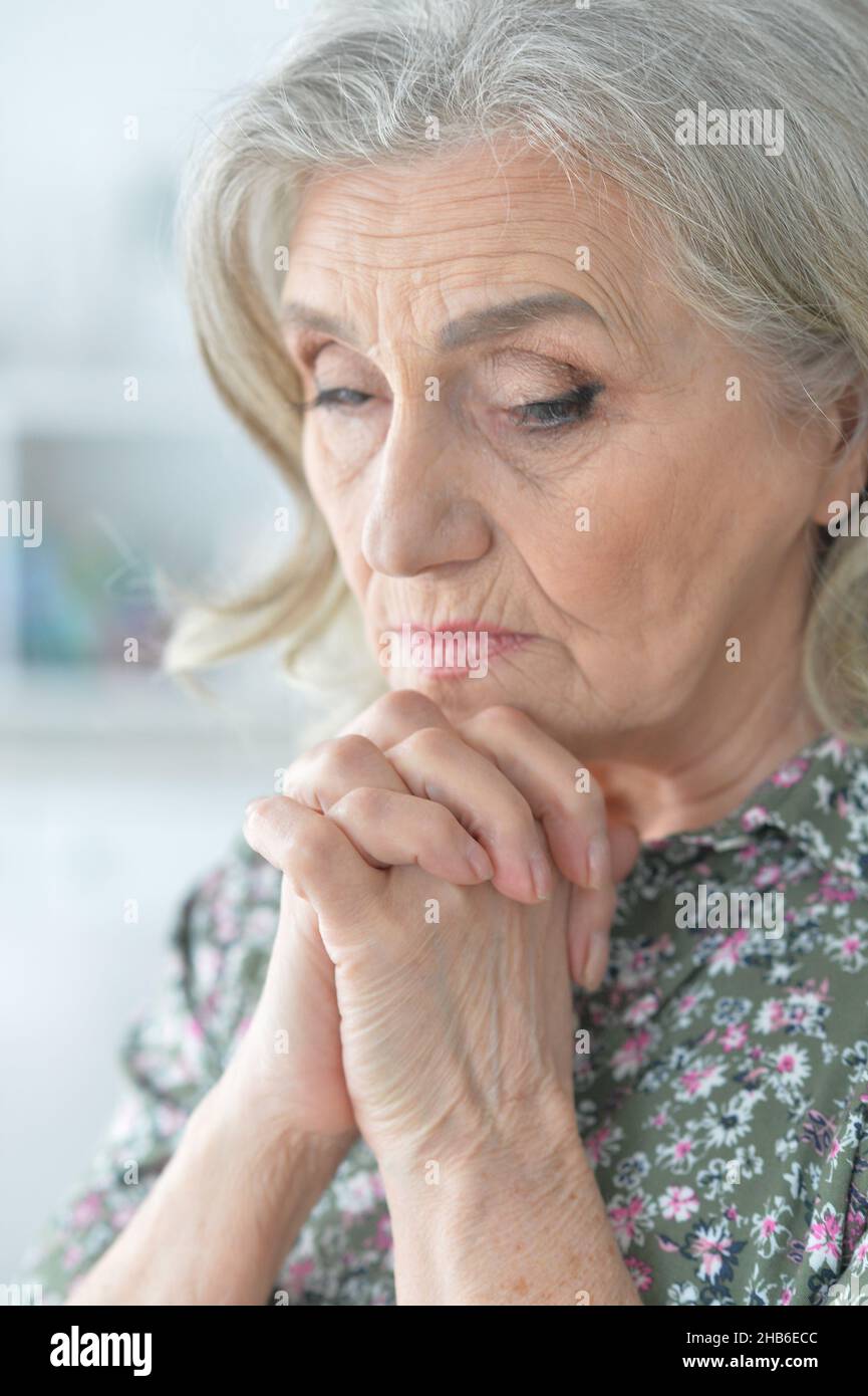 Close up portrait of sad senior woman Stock Photo - Alamy