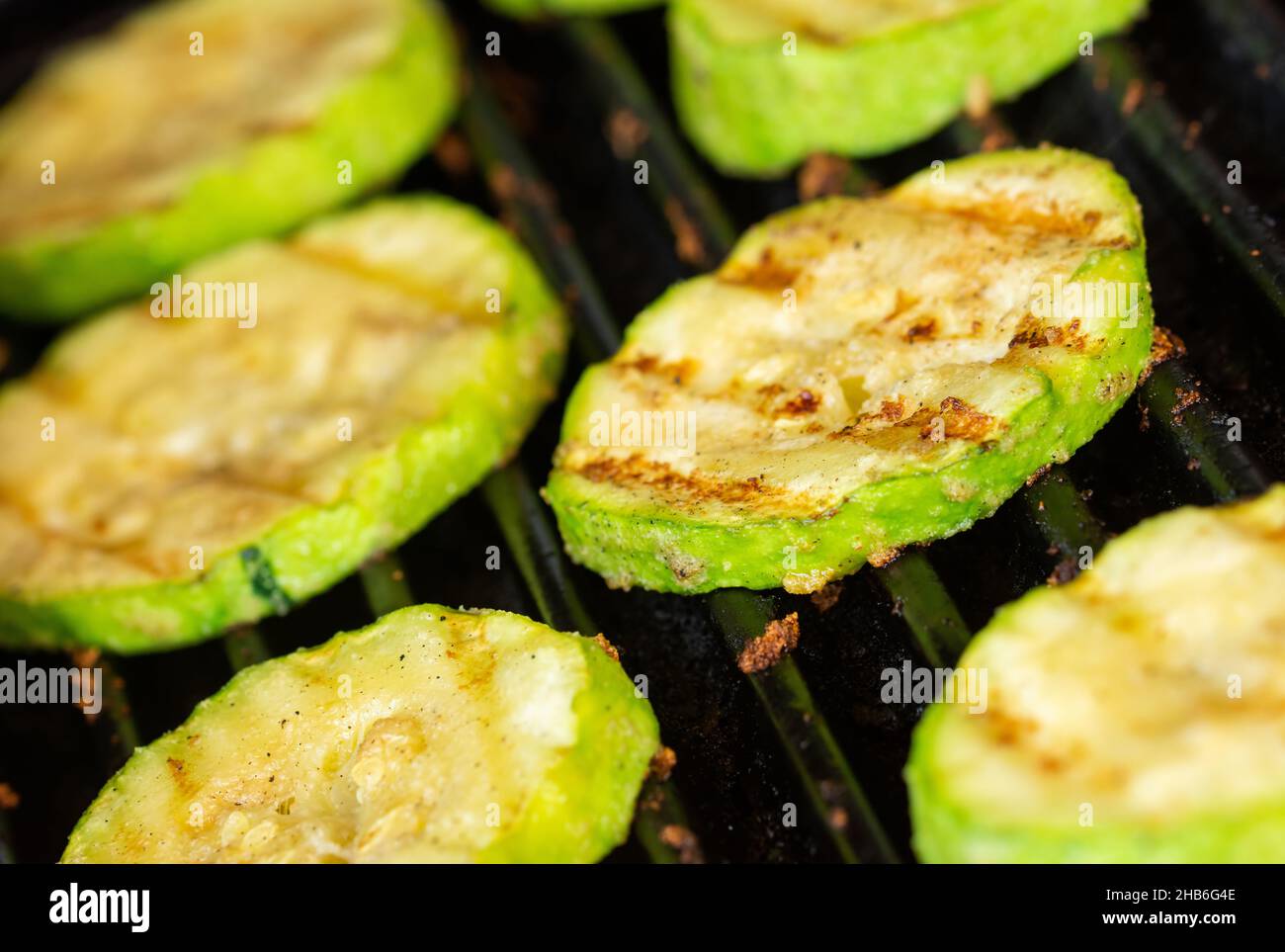 Close-up of grilled zucchini slice prepared on a grill Stock Photo - Alamy