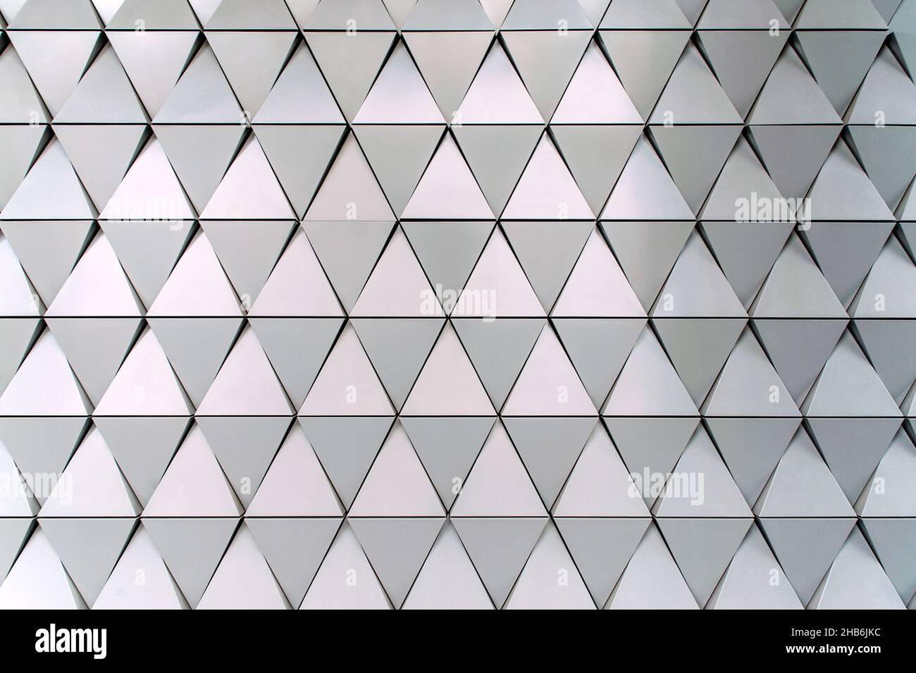 Building structures of aluminum triangle geometry on facade of modern ...