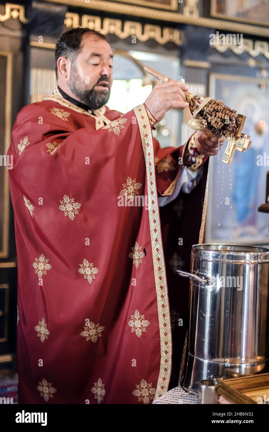 Holy water consecration in orthodox church. Religious priest during ...