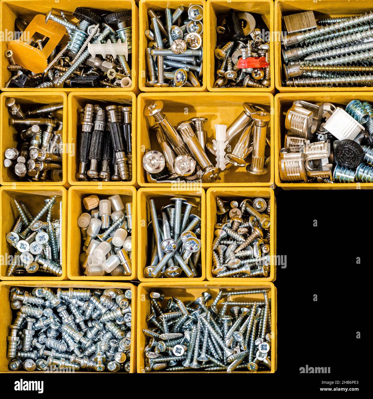 Yellow case with small construction objects. Many storage compartments ...