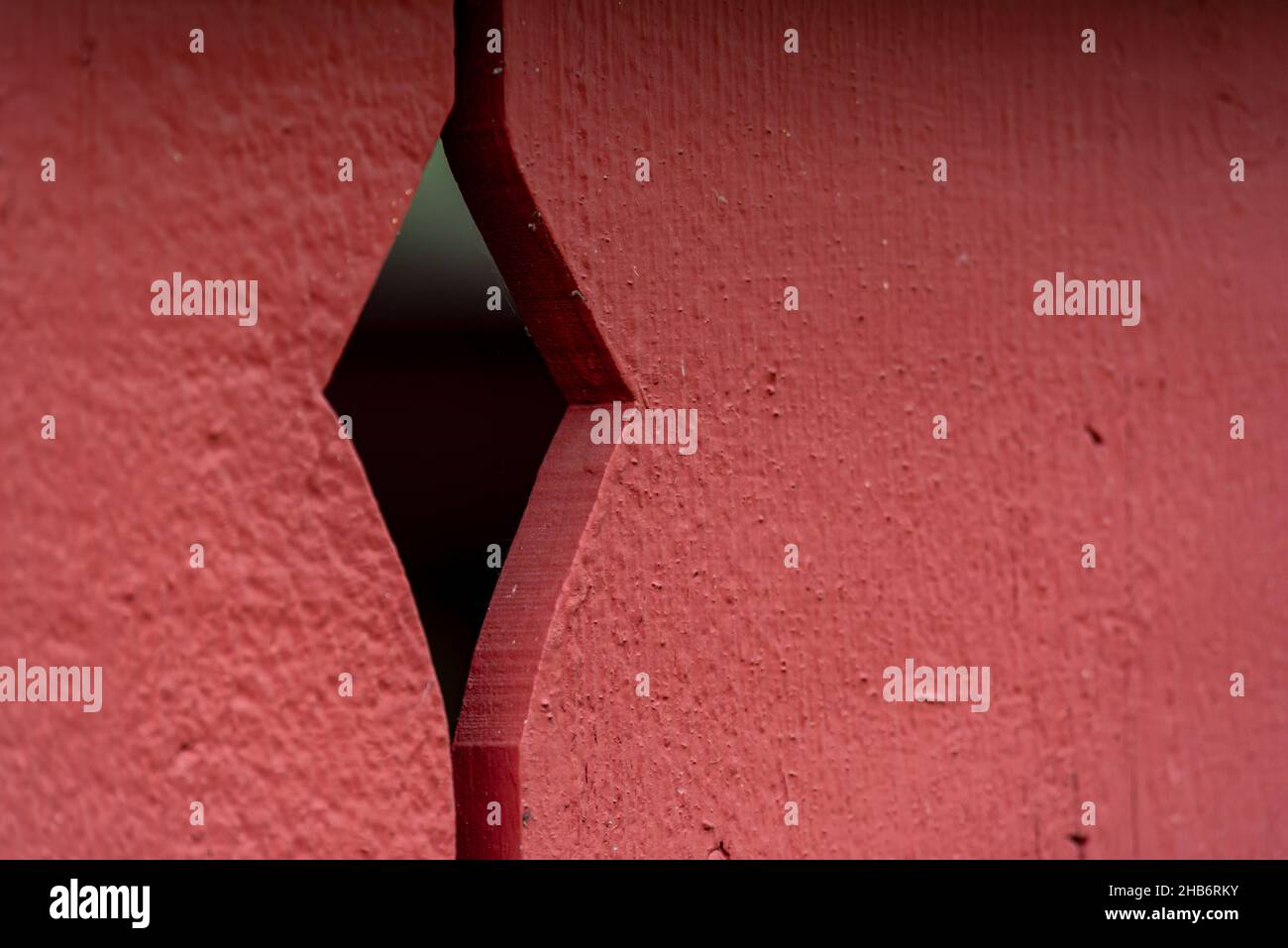 Artistic diamond shape designed into a red fence Stock Photo - Alamy