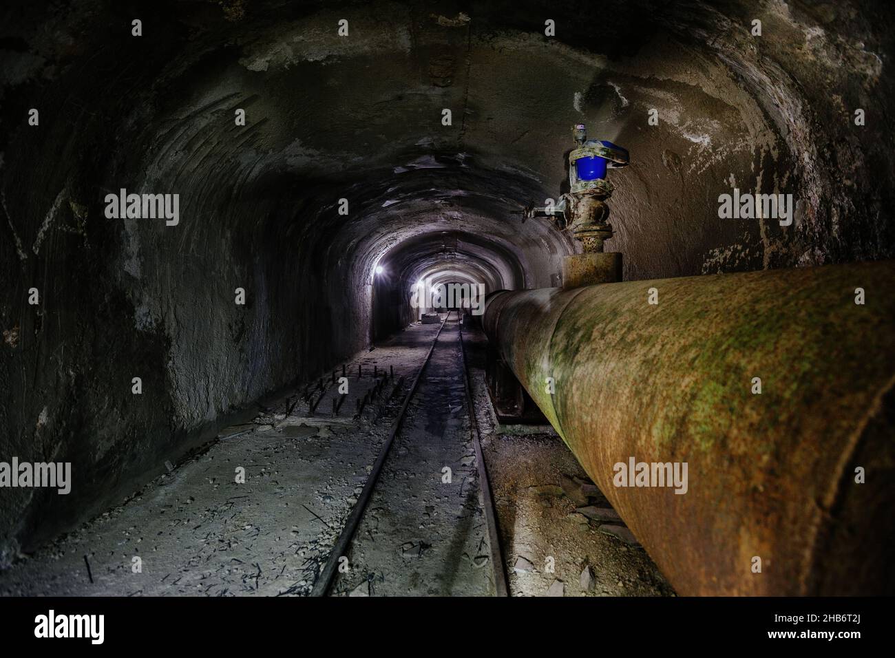 Vaulted concrete underground tunnel of sewer, heating duct or water ...