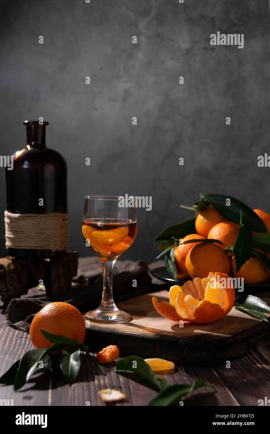 Homemade tangerine alcohol drink, rustic beverage still life Stock ...