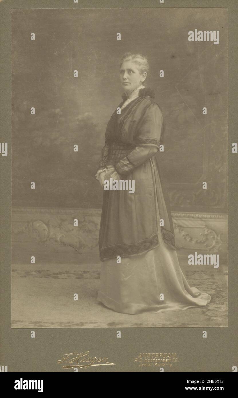 Mrs. M. Lobry van Troostenburg de Bruyn-Simon Thomas in an evening gown ...