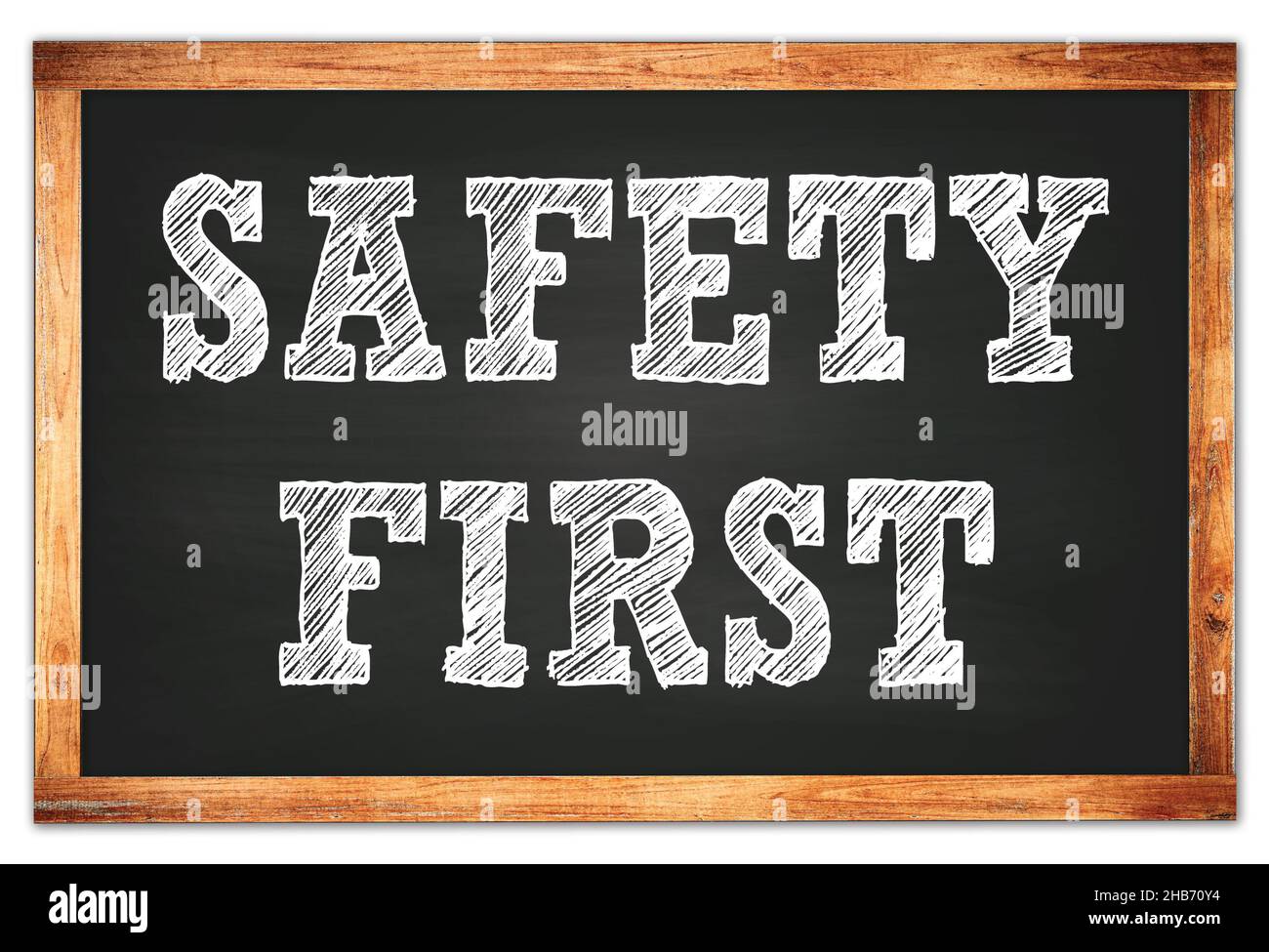 SAFETY FIRST written on black wooden frame school blackboard Stock ...