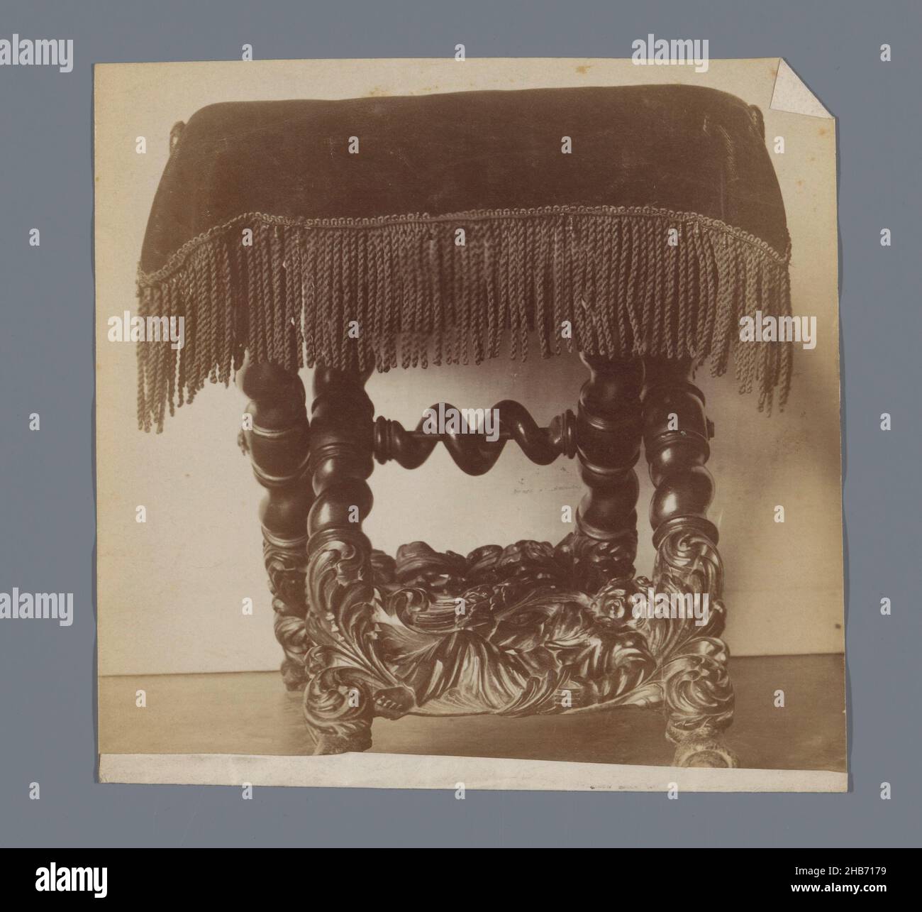 Stool with turned legs decorated with leaf motifs and a reclining ...