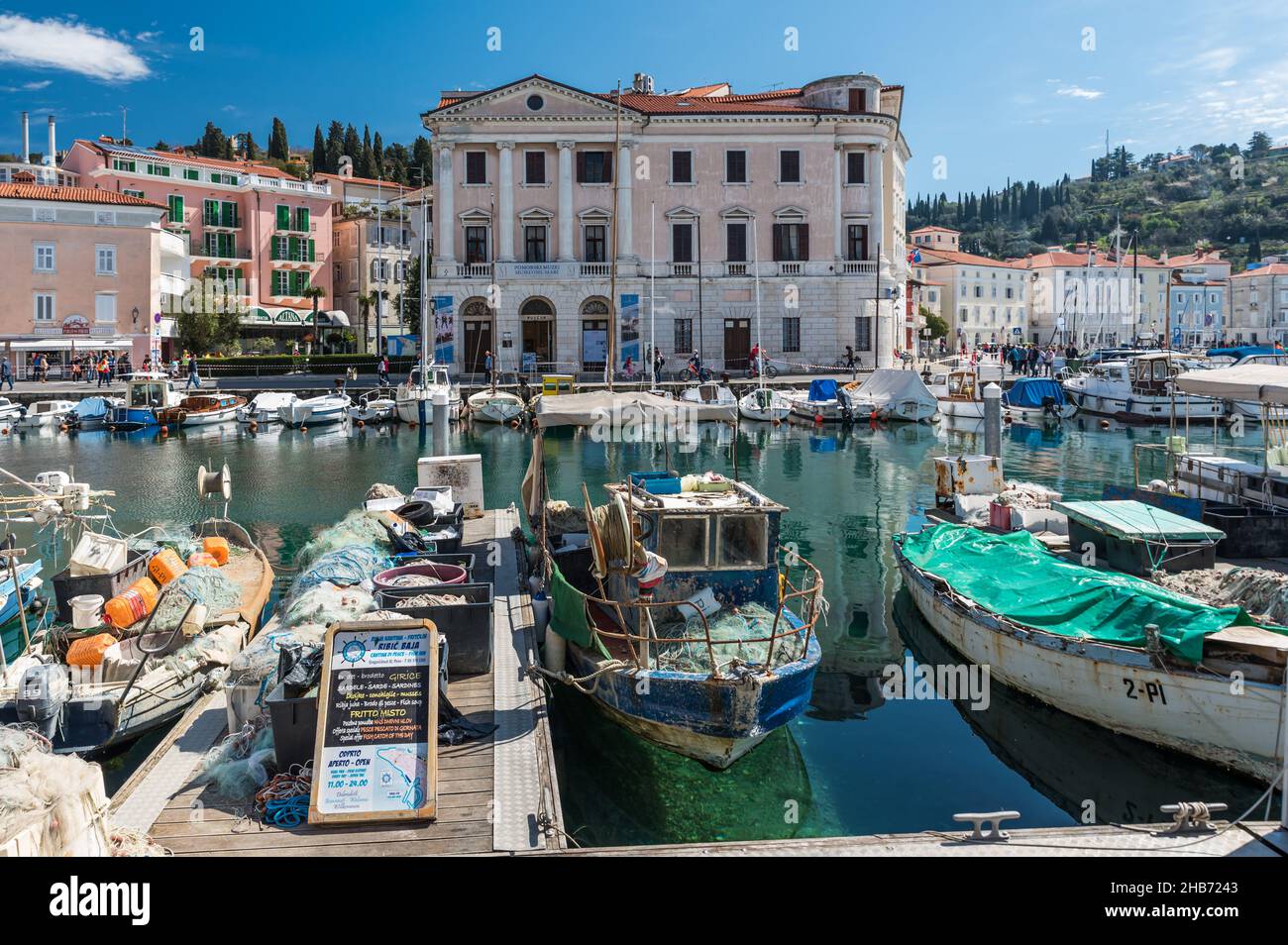 Piran, Slovenia - 04 07 2018: the port of Piran with boats and houses ...