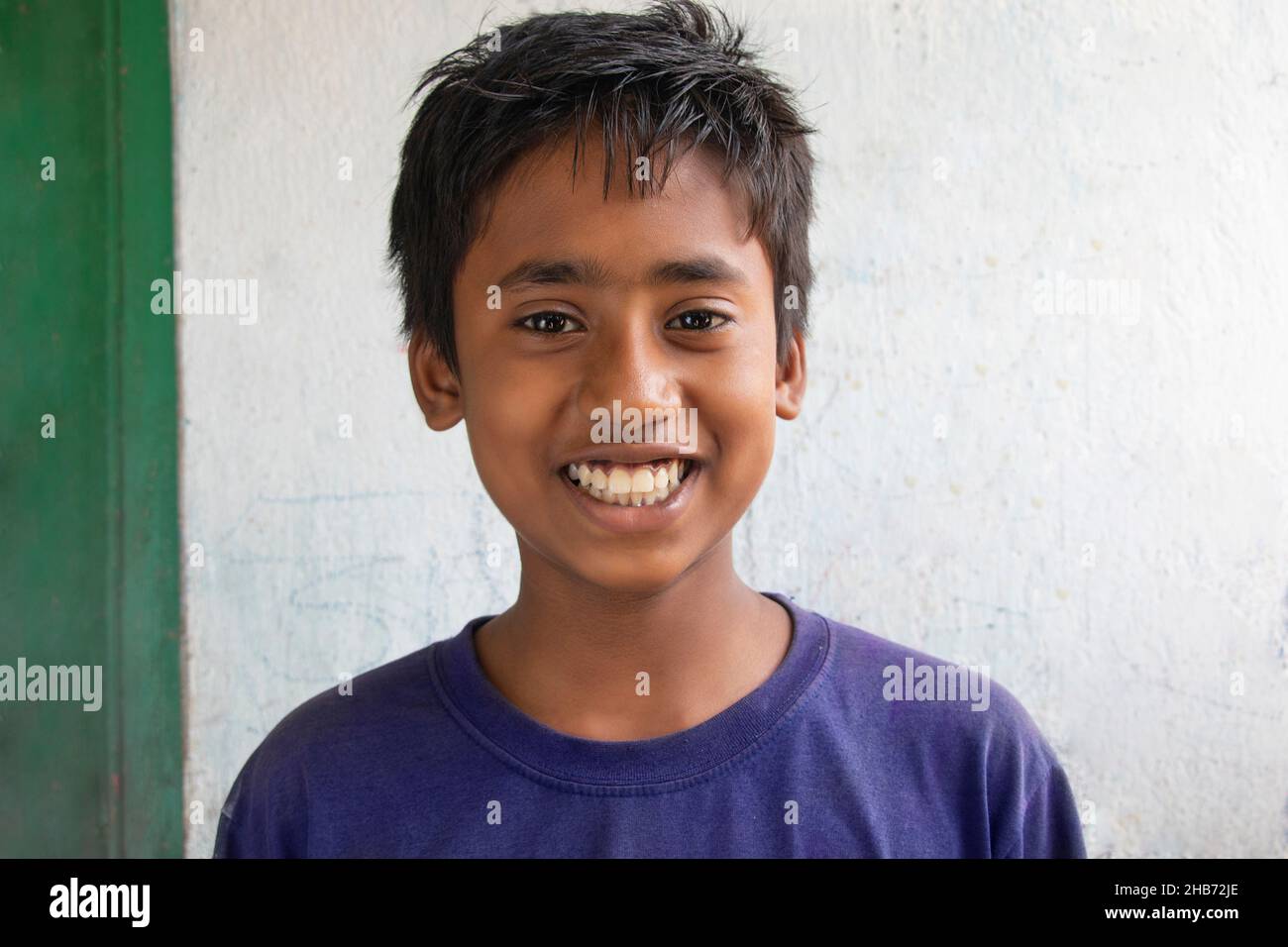 Portrait of a young rural boy smiling Stock Photo - Alamy