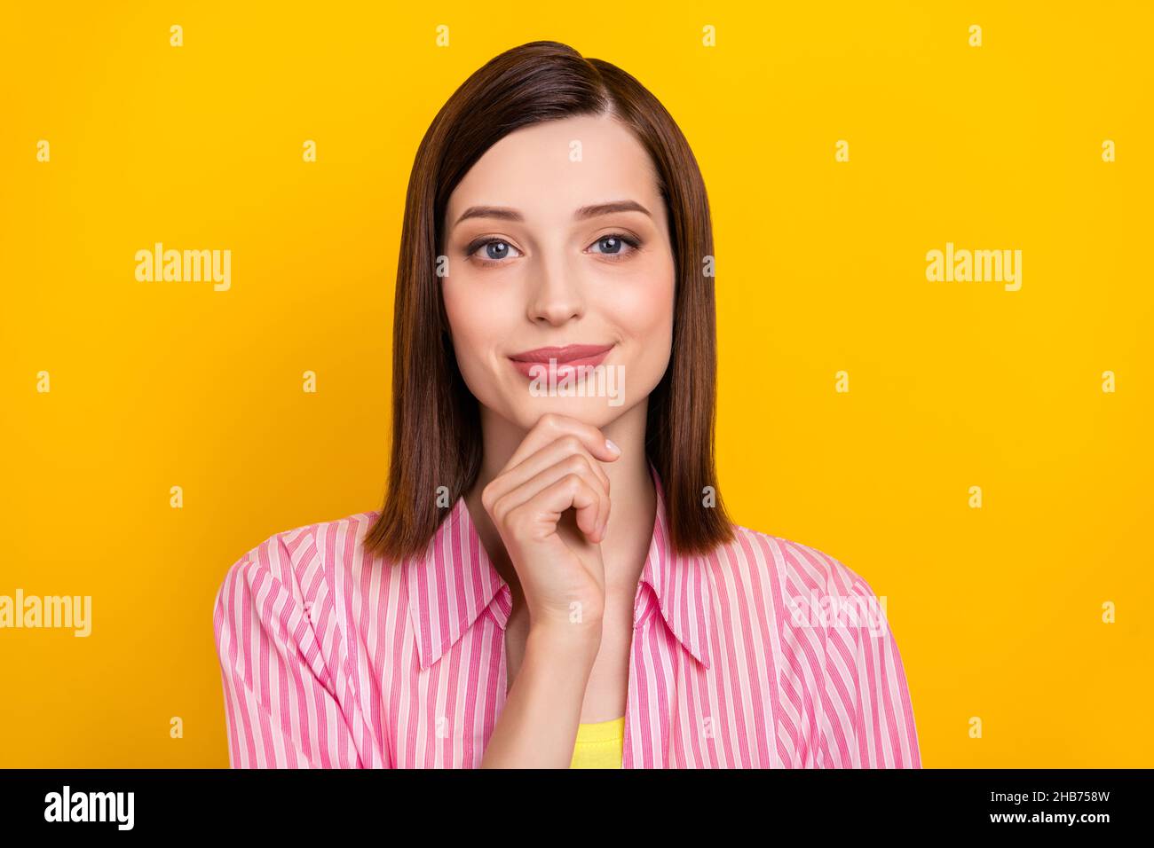 Photo of satisfied candid person arm touch chin look camera minded ...