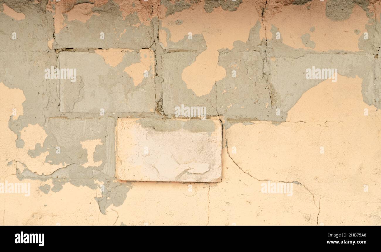 Wall of bricks painted with a pale peach paint Texture of masonry ...