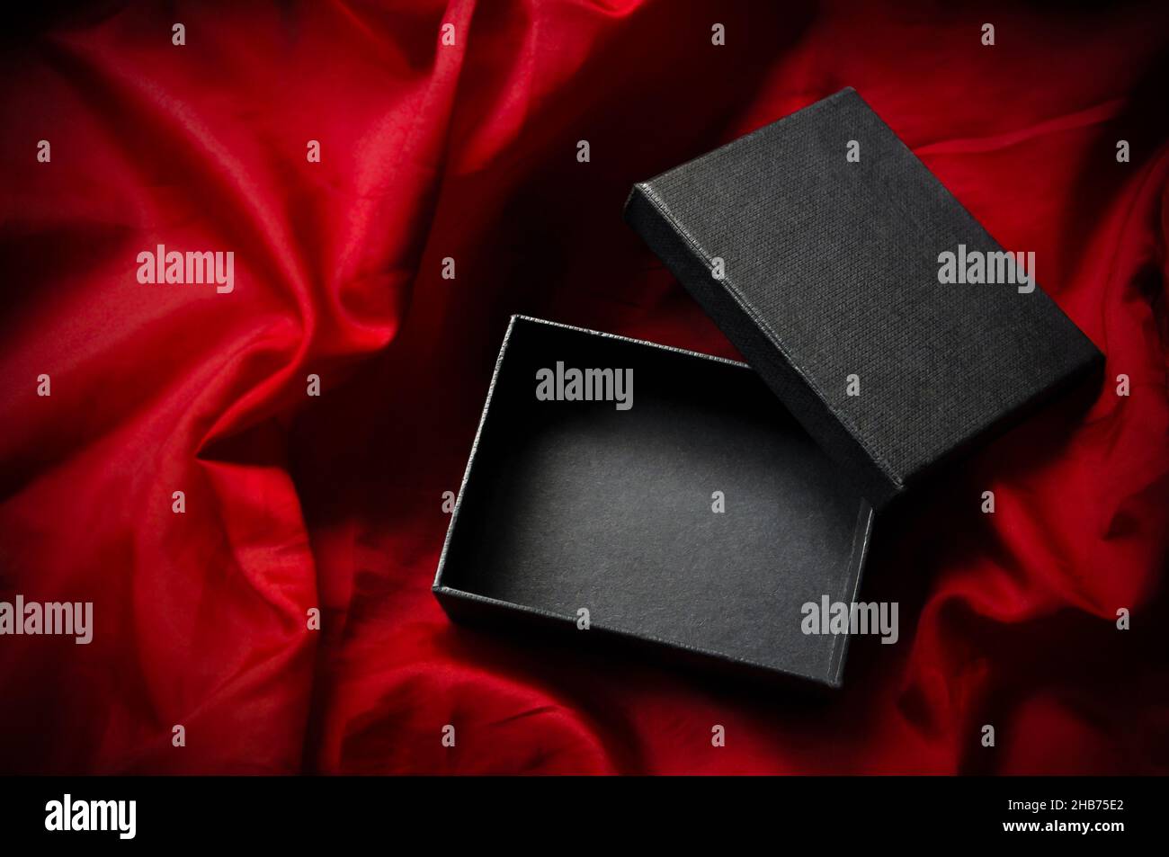Dark red background. Satin. Black double box. Gift preparation Stock ...