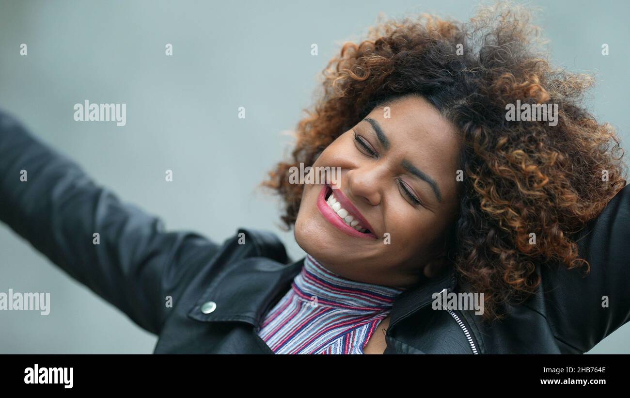 Carefree black woman portrait smiling feeling free Stock Photo - Alamy