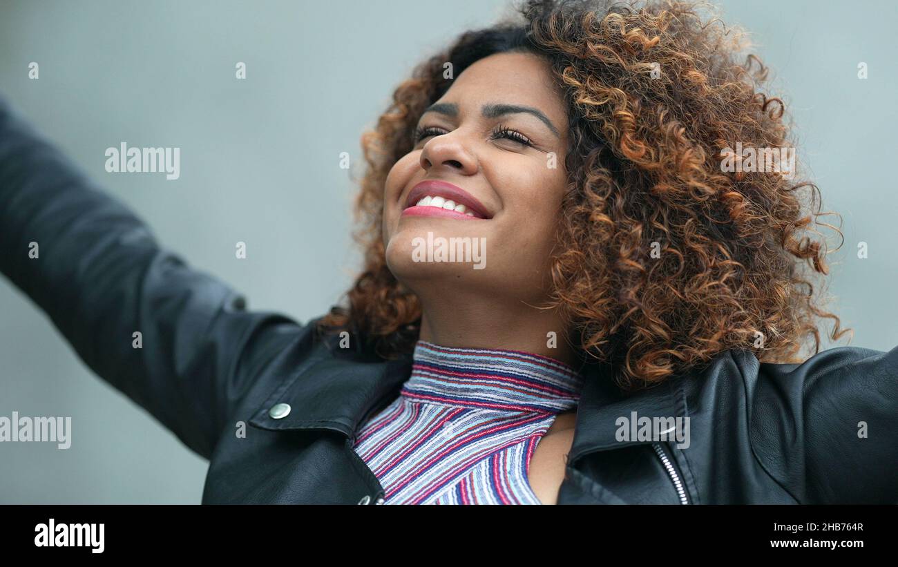 Carefree black woman portrait smiling feeling free Stock Photo - Alamy