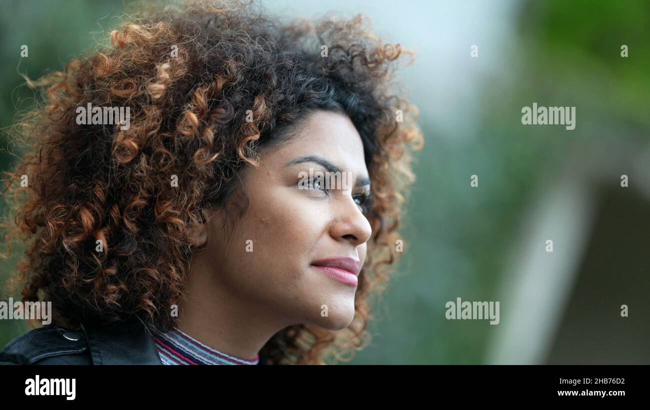 Woman face opening eyes in meditation and contemplation looking up at ...