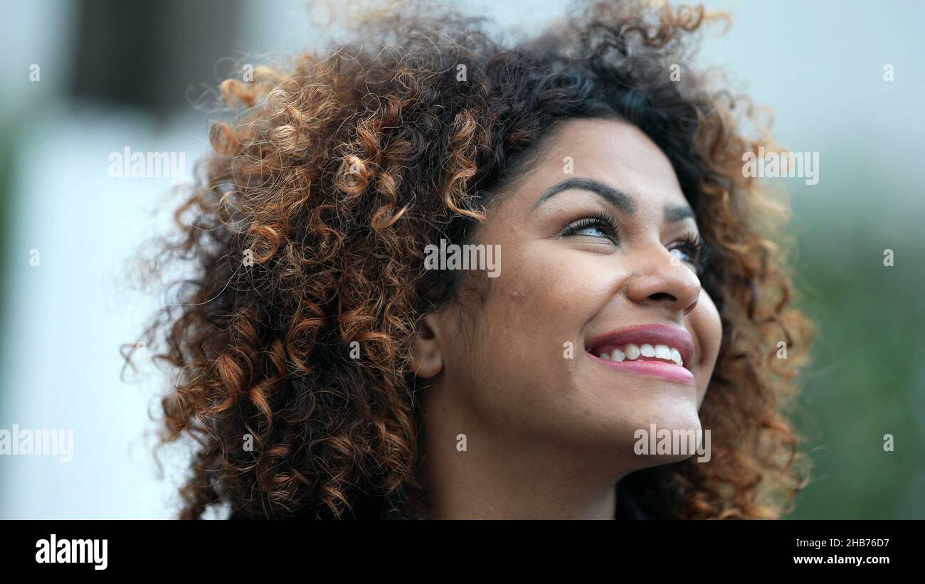Woman face opening eyes in meditation and contemplation looking up at ...