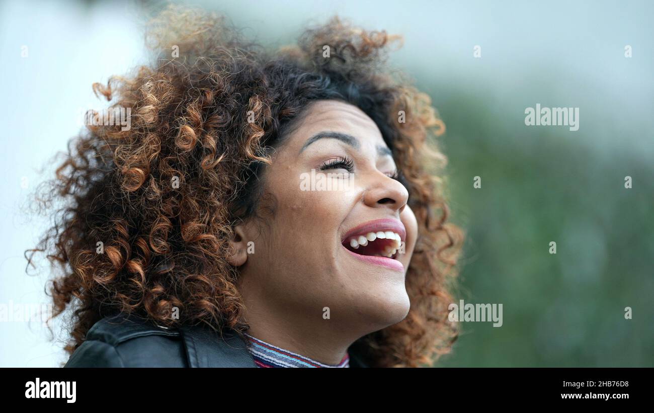 Woman face opening eyes in meditation and contemplation looking up at ...
