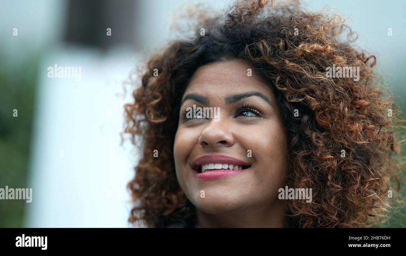 Woman face opening eyes in meditation and contemplation looking up at ...