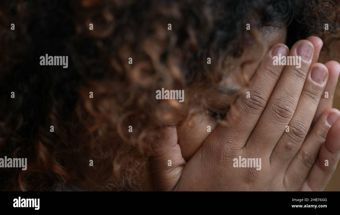 Woman filled with regret covering face with hands Stock Photo - Alamy