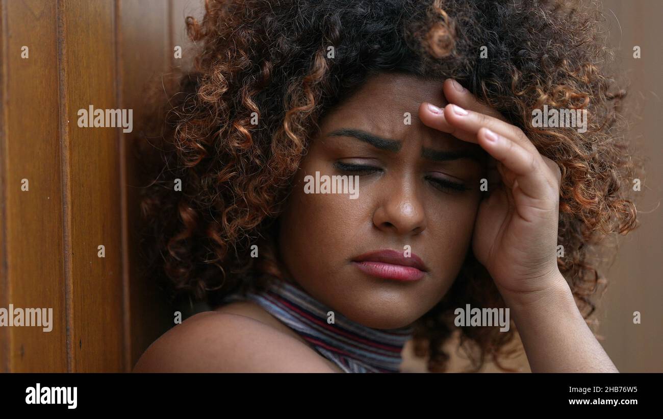 Worried black woman covering face with hands feeling regret Stock Photo ...