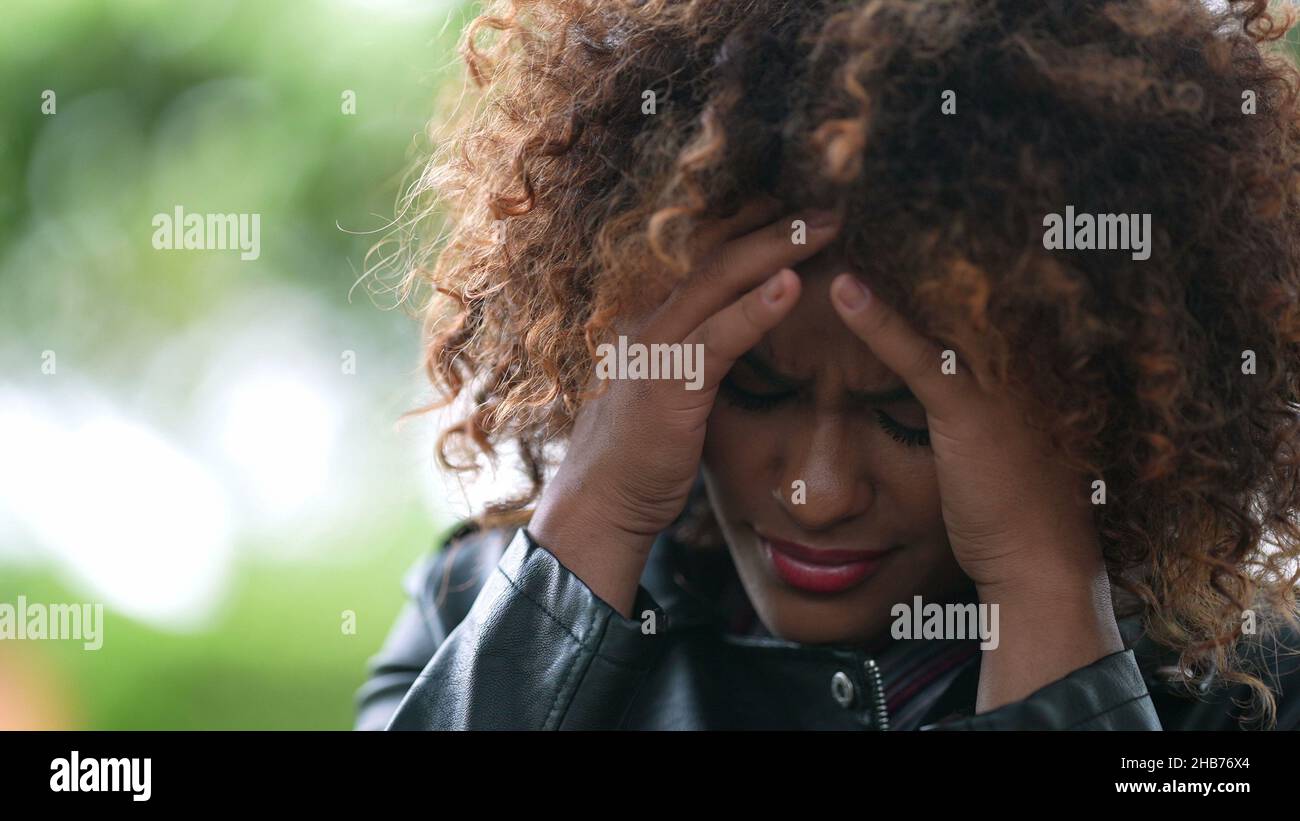 Worried black African woman suffering from emotional problems Stock ...