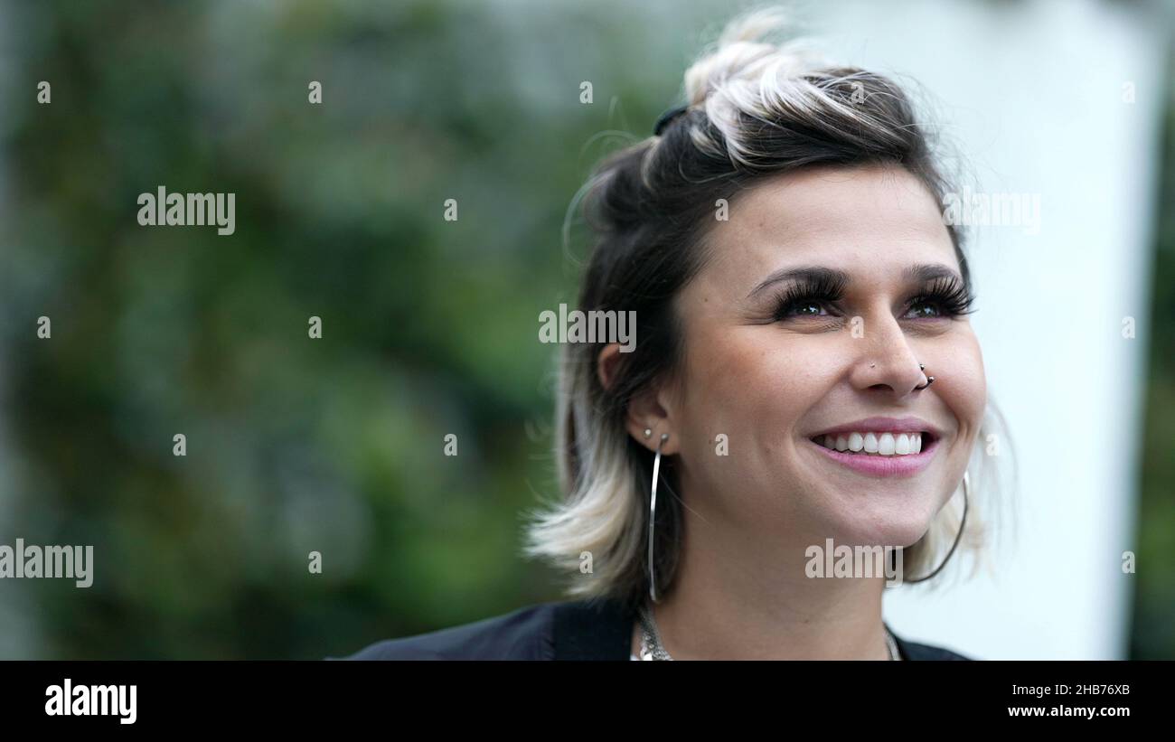 Young woman contemplative face close-up feeling breeze Stock Photo - Alamy