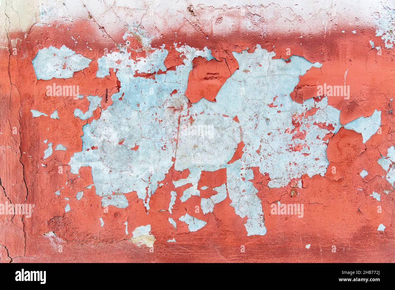 Old concrete wall with red cracked paint texture. Stains on the rough ...