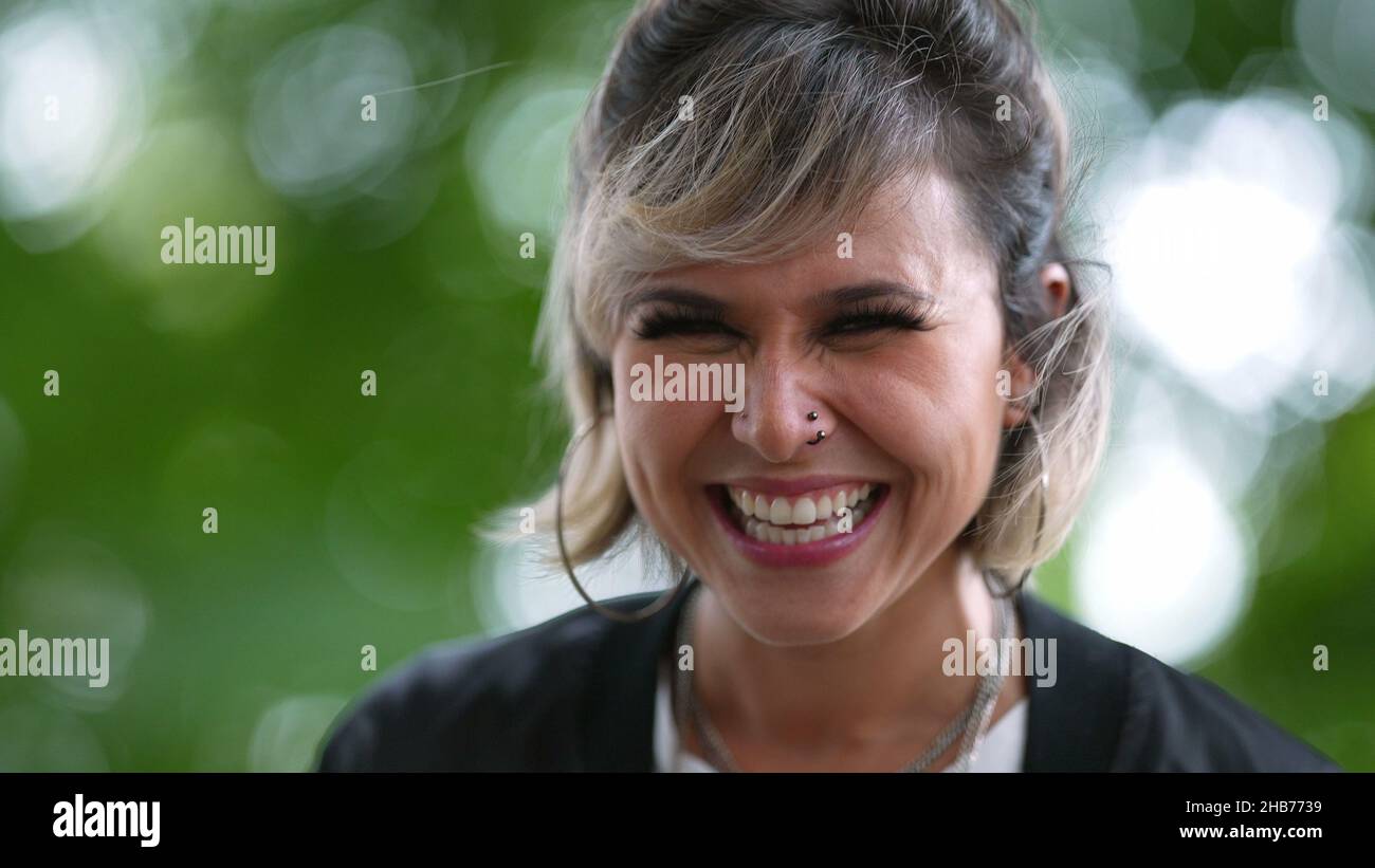 Young woman spontaneous laughter. Portrait person real life laugh and ...