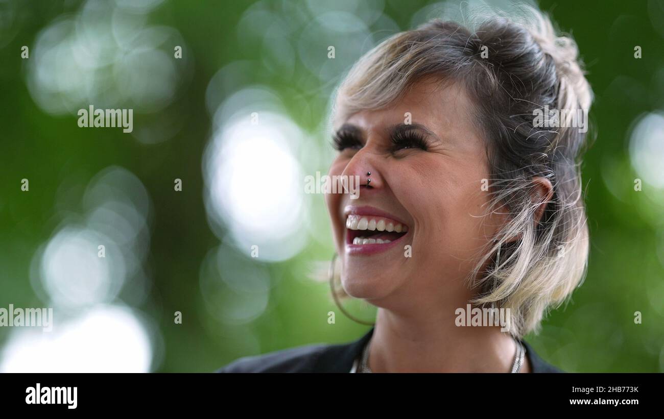 Young woman spontaneous laughter. Portrait person real life laugh and ...