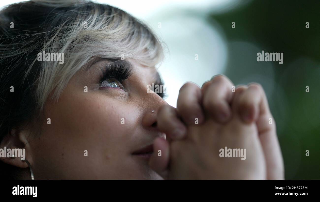 Young woman prays to God looking up to sky with HOPE Stock Photo - Alamy