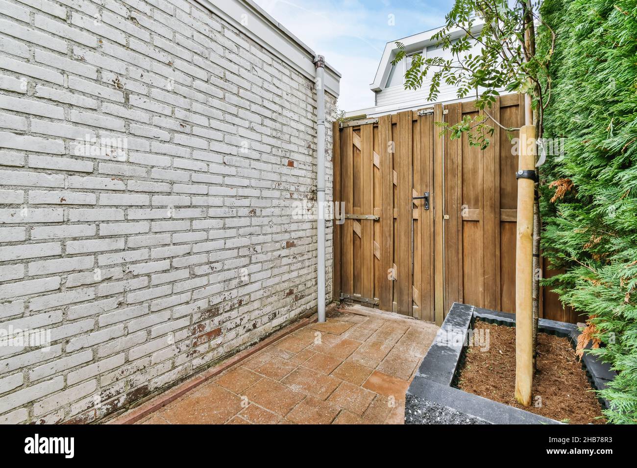View of the back wooden gate of the house Stock Photo - Alamy