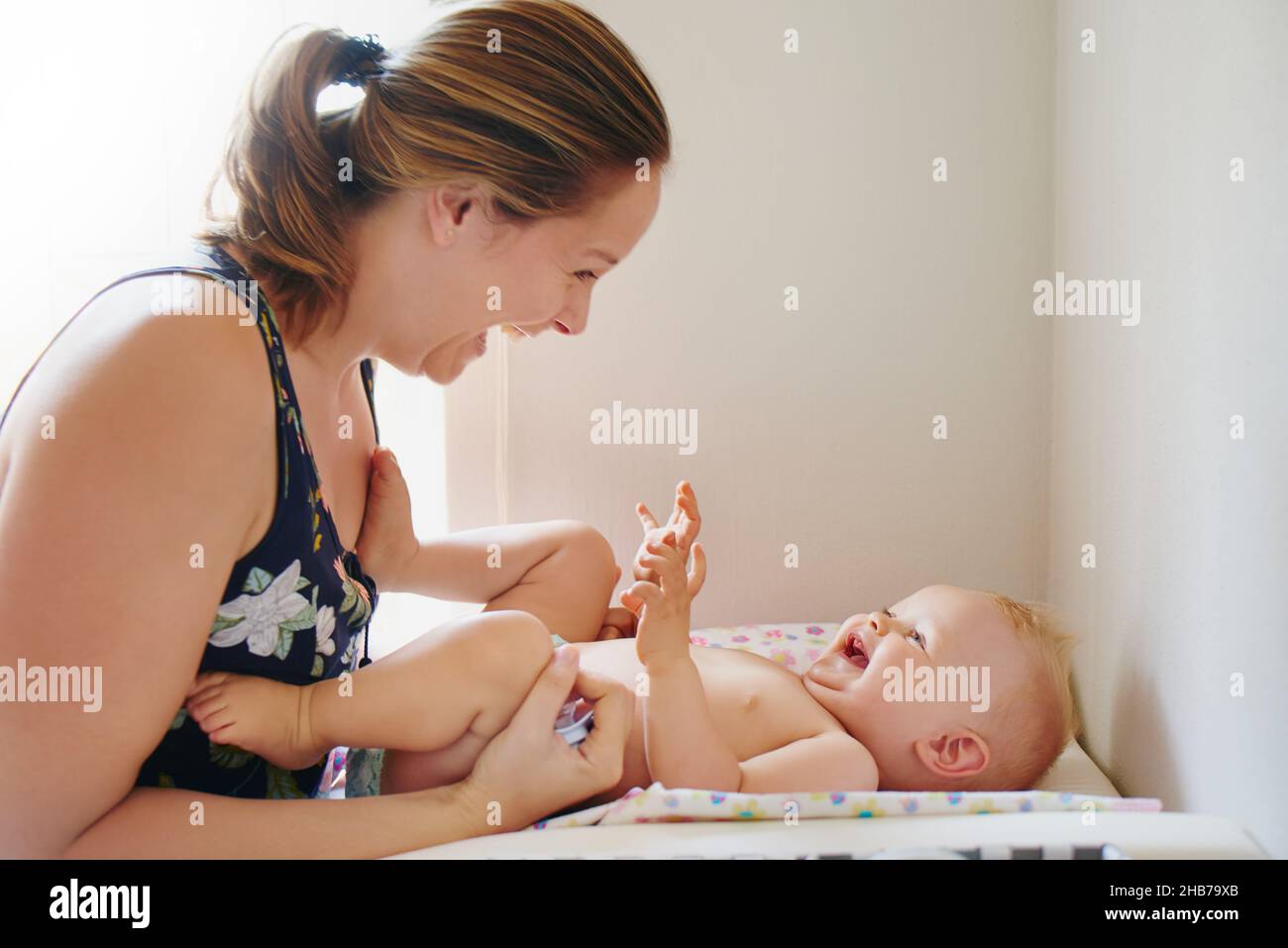 Nothing like a fresh diaper to make baby happy Stock Photo - Alamy