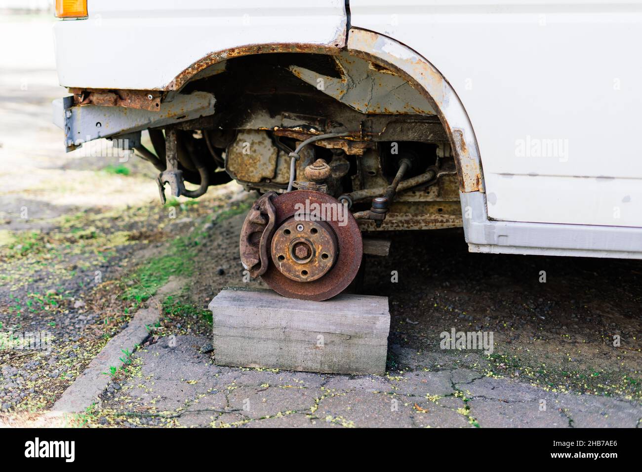 Old rusty car wheel. Cracked tires and a rusted hubcaps Stock Photo - Alamy