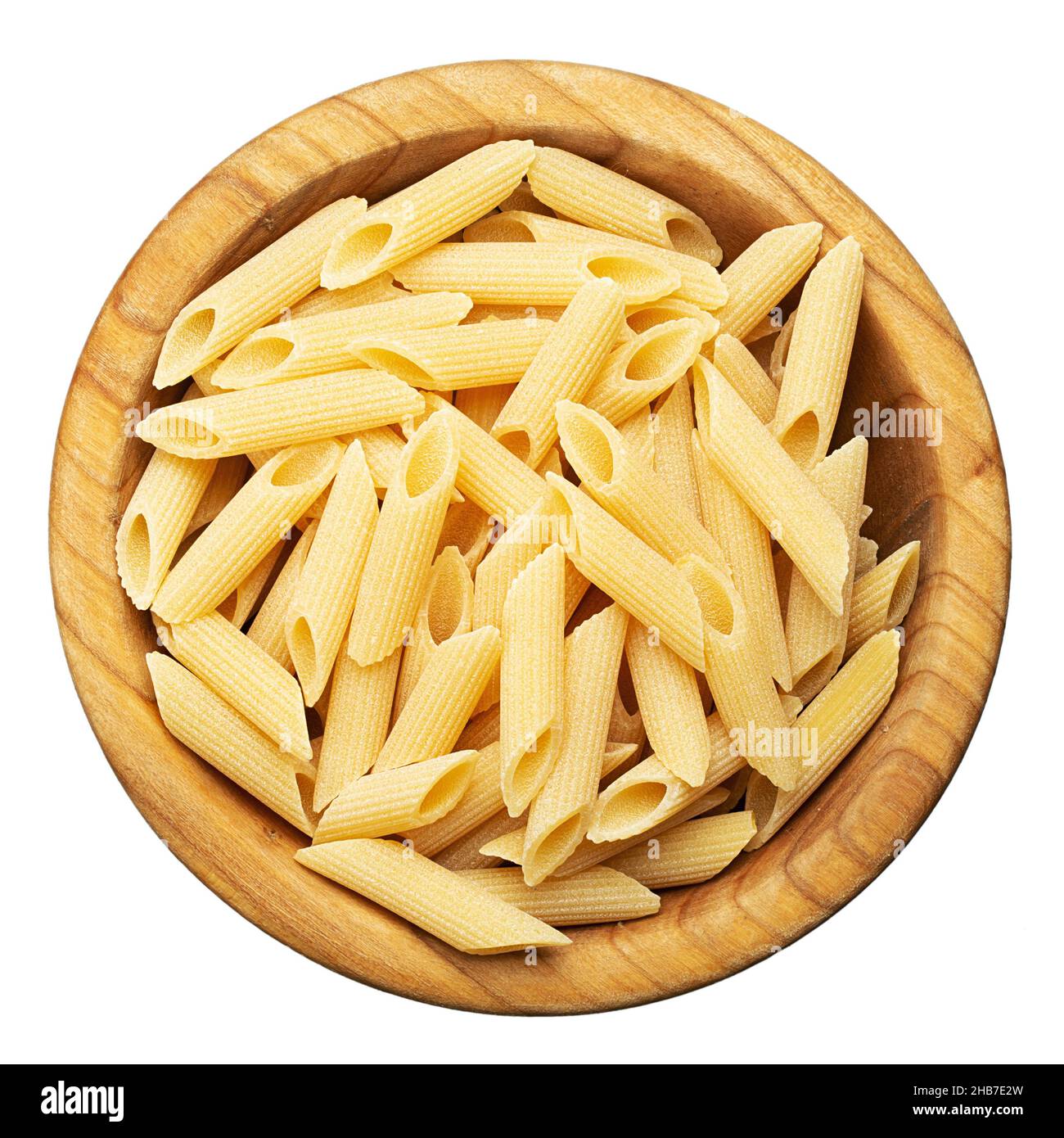 Pennette rigate. Raw pasta in a plate isolated on white background. Top ...