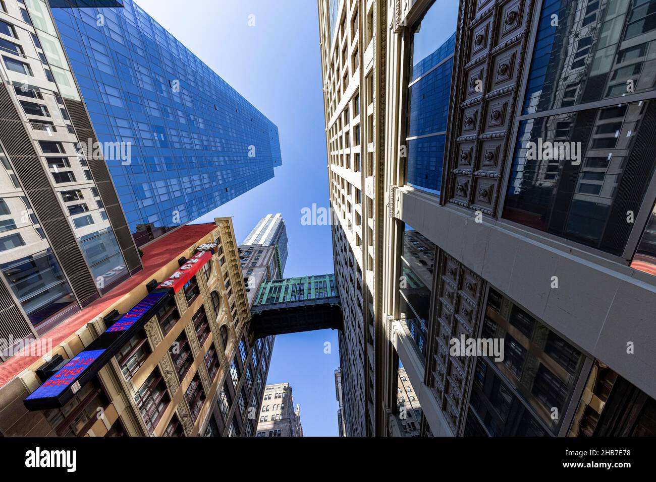 Looking up at a skybridge on W. 32nd Street connecting buildings in the ...