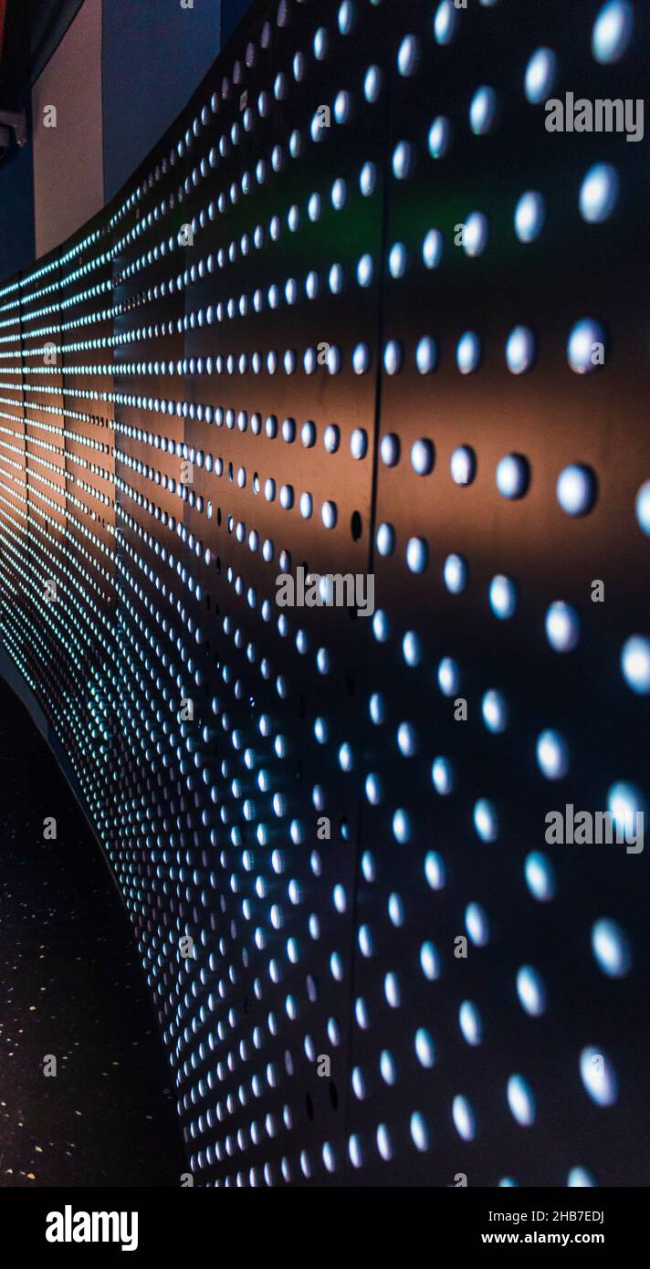 Shot of a futuristic neon wall installation Stock Photo - Alamy