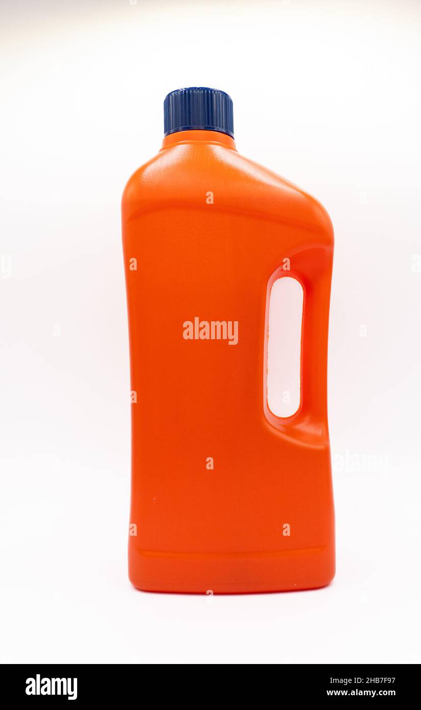 orange plastic bottle with blue cap for household chemicals Stock Photo ...