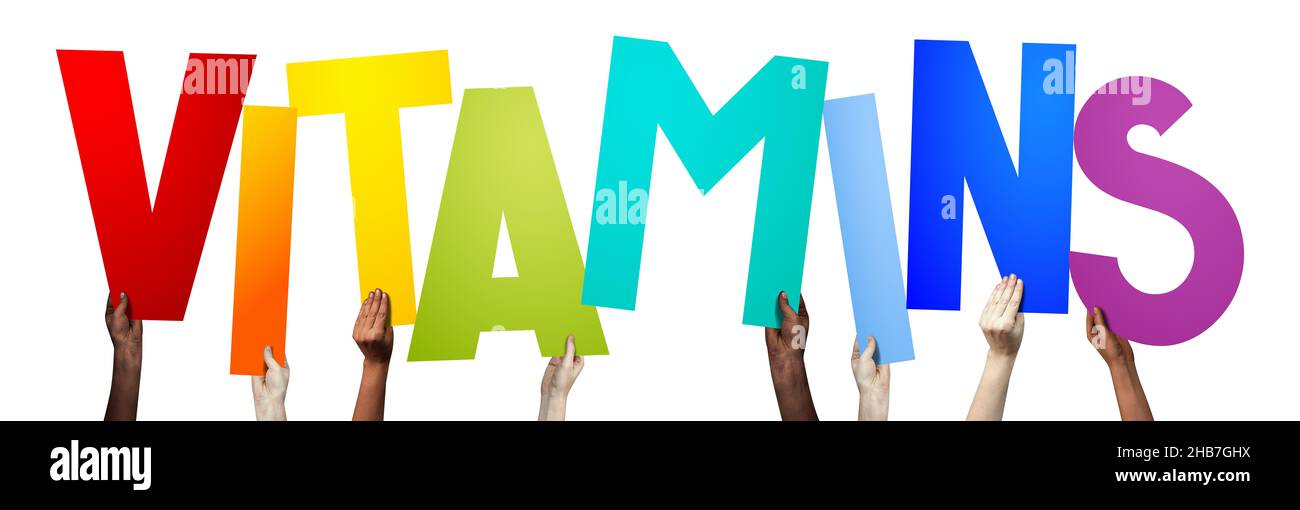 Vitamis - human hands holding colorful letters Stock Photo - Alamy