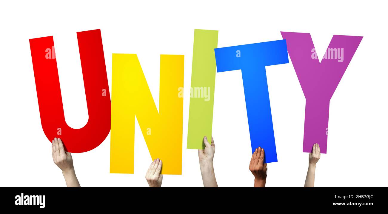 Unity - human hands holding colorful letters Stock Photo - Alamy