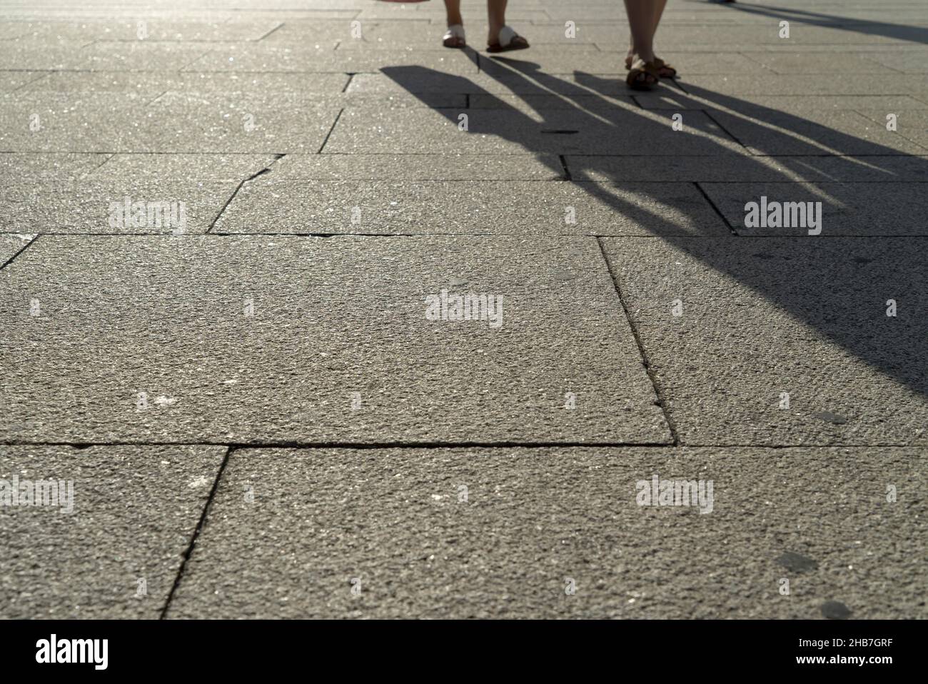 Beautiful shot of the shadows of two people walking on the ground Stock ...