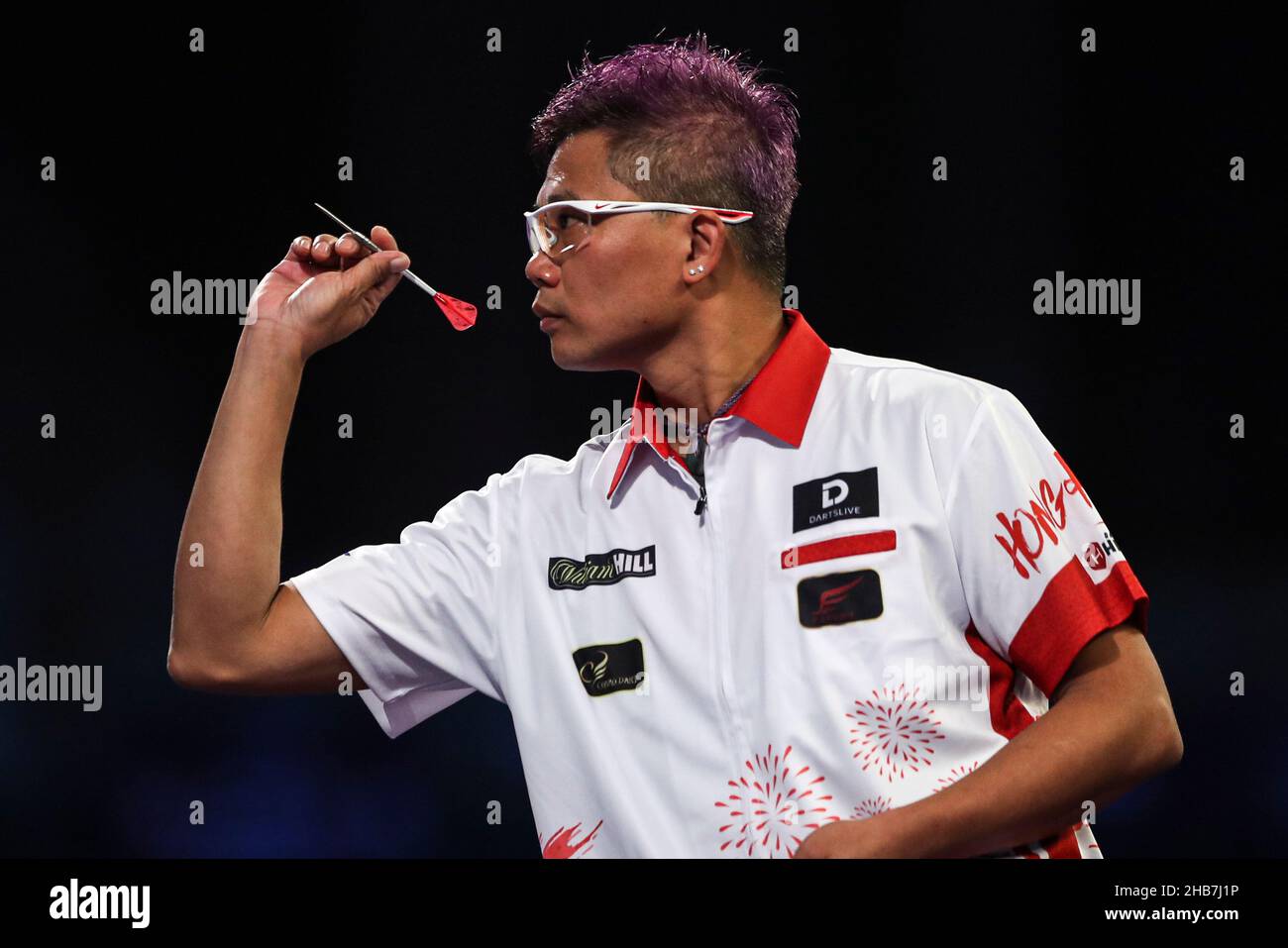 Royden Lam in action during day three of the William Hill World Darts Championship at Alexandra ...