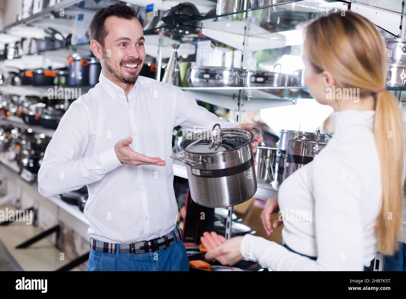 Young loving couple deciding on best saucepan Stock Photo - Alamy