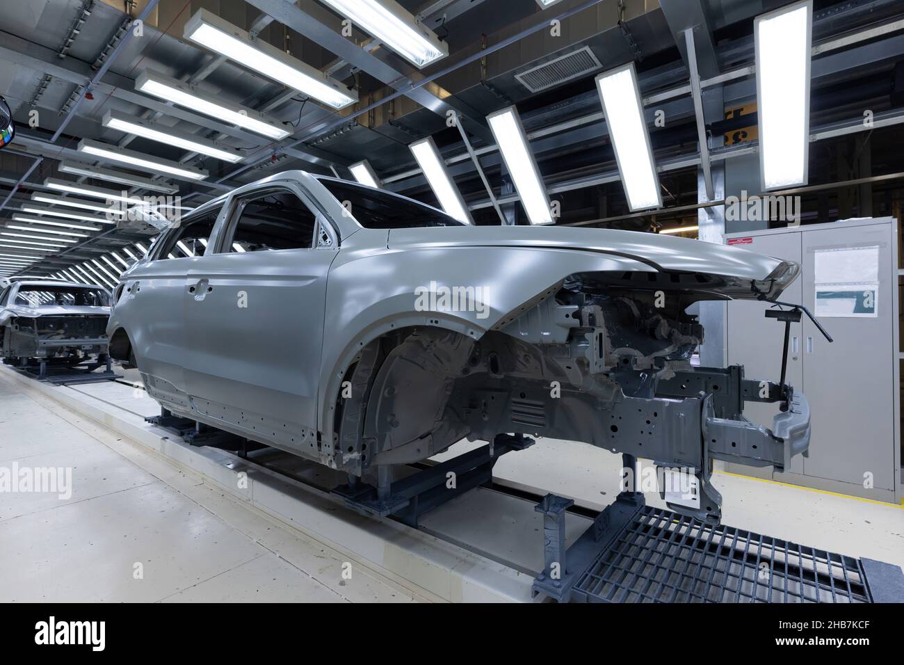 Car bodies are on assembly line. Factory for production of cars. Modern ...