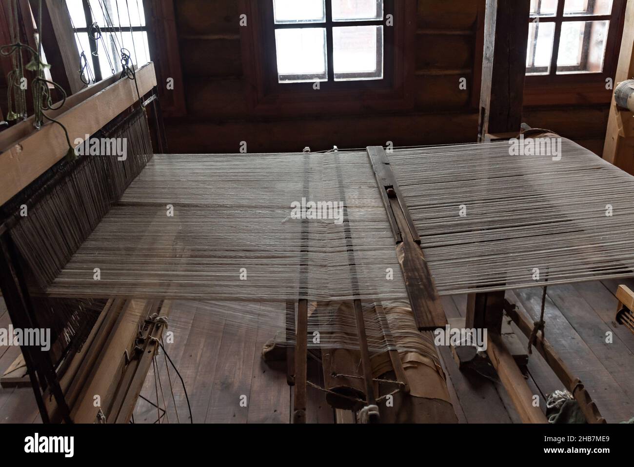 Antique weaving loom with threads in folk crafts museum Stock Photo - Alamy
